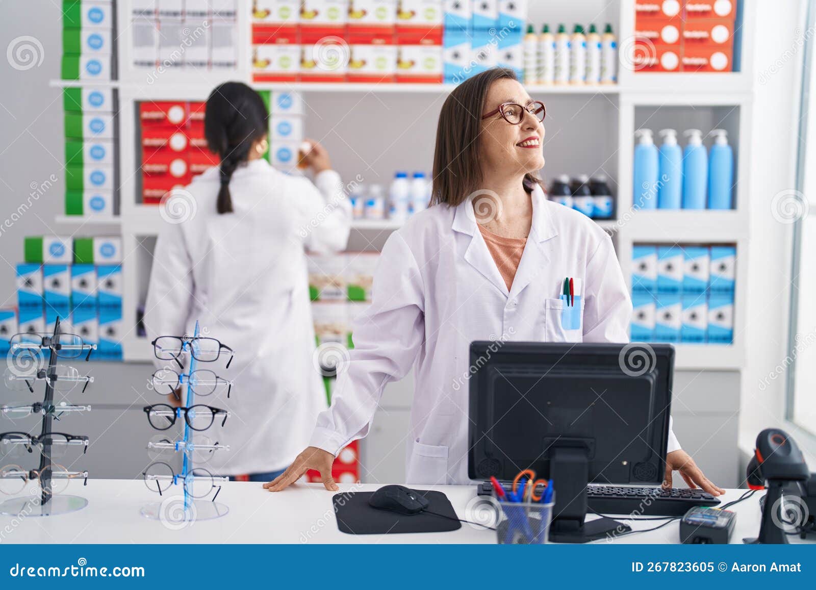 Two Women Pharmacist Using Computer Working at Pharmacy Stock Image ...