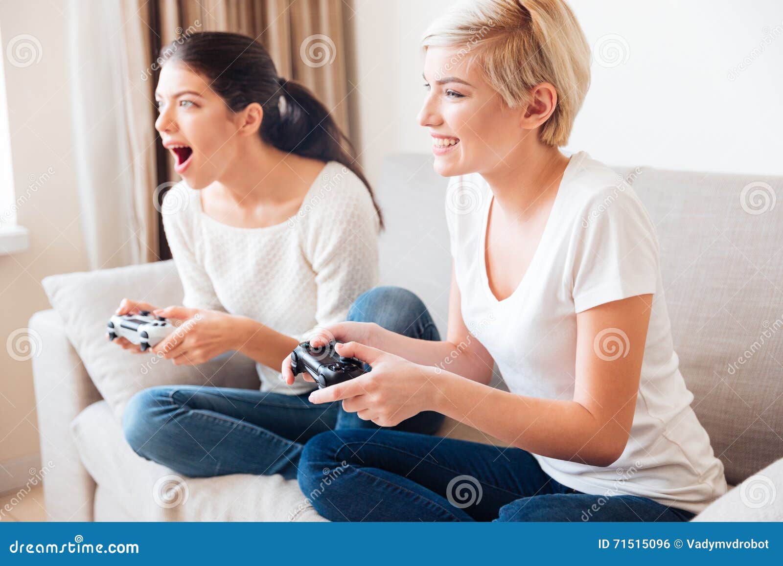 Two Women Playing Video Games Stock Photo - Image of pretty, cheerful ...