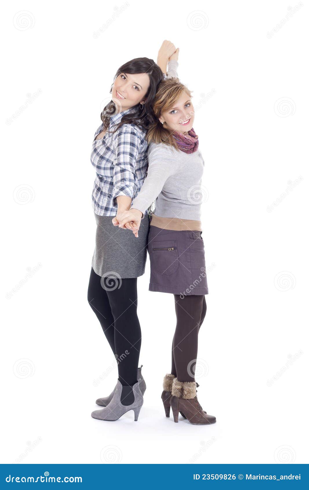 Two women posing in studio stock photo. Image of girl - 23509826