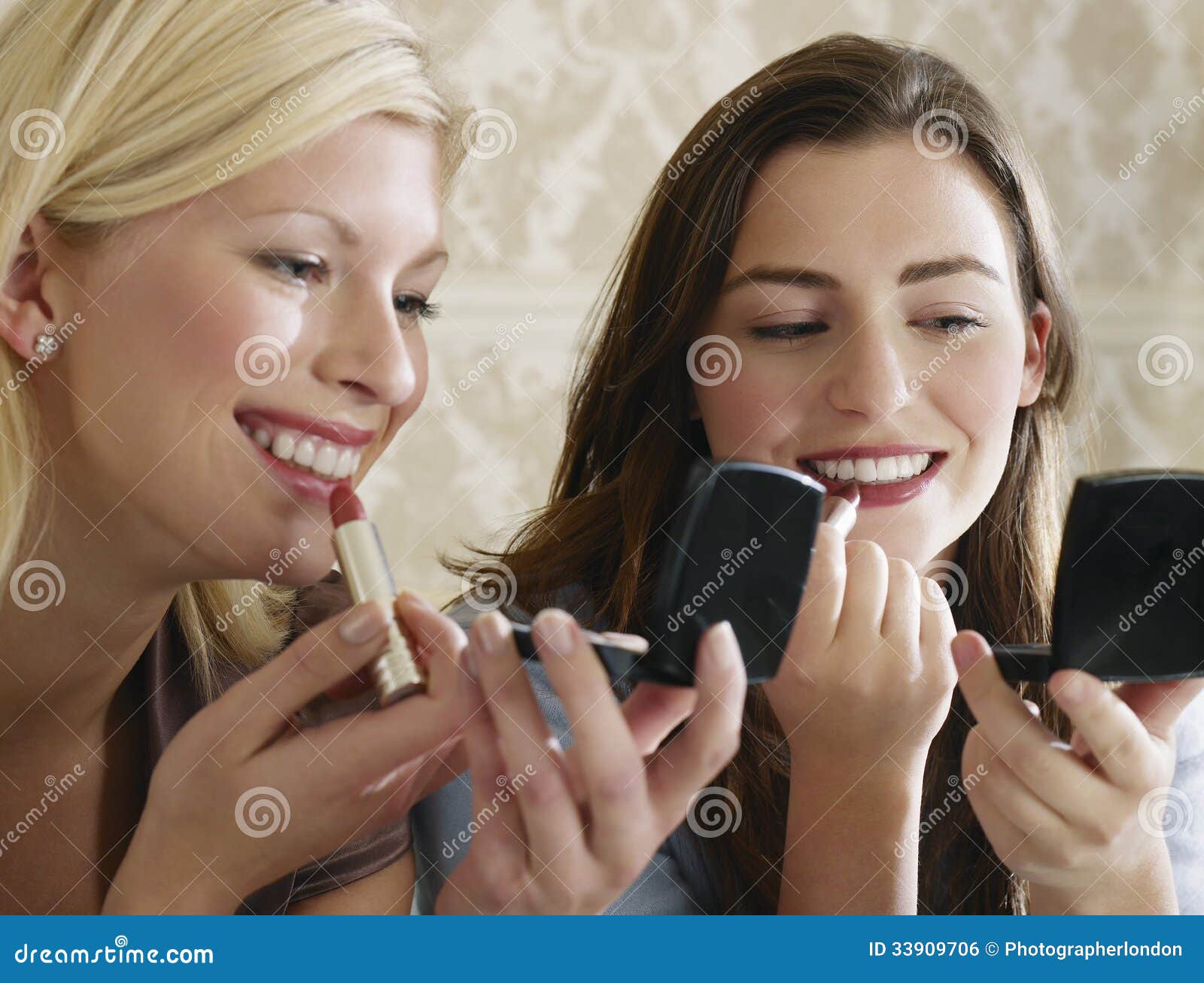 Two Women Putting on Makeup Stock Photo - Image of enjoying, people ...