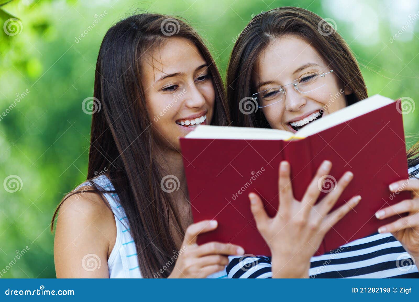 Two women read red book stock photo. Image of happy, gospel - 21282198