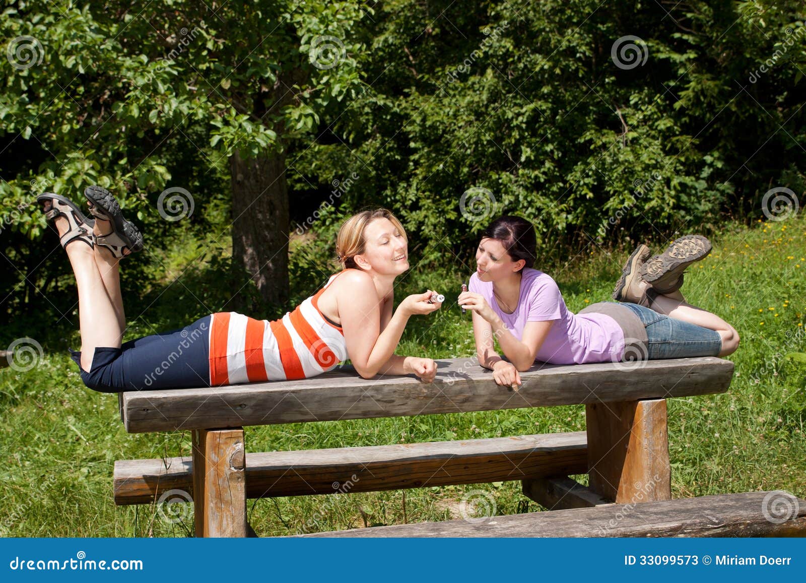 Two women relax in nature stock image. Image of health - 33099573