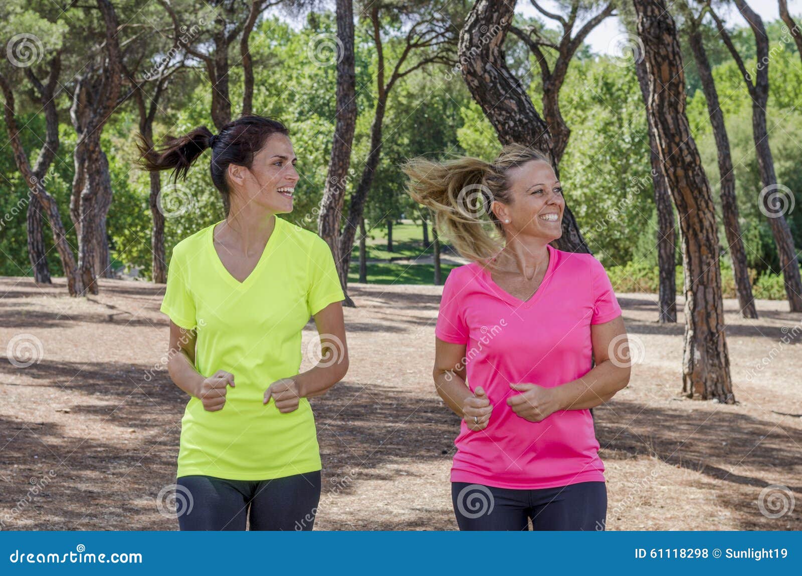 Two women are running. stock photo. Image of eyes, active - 61118298