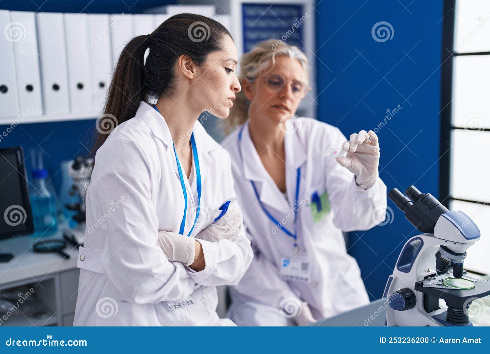 Two Women Scientists Looking Sample at Laboratory Stock Photo - Image ...