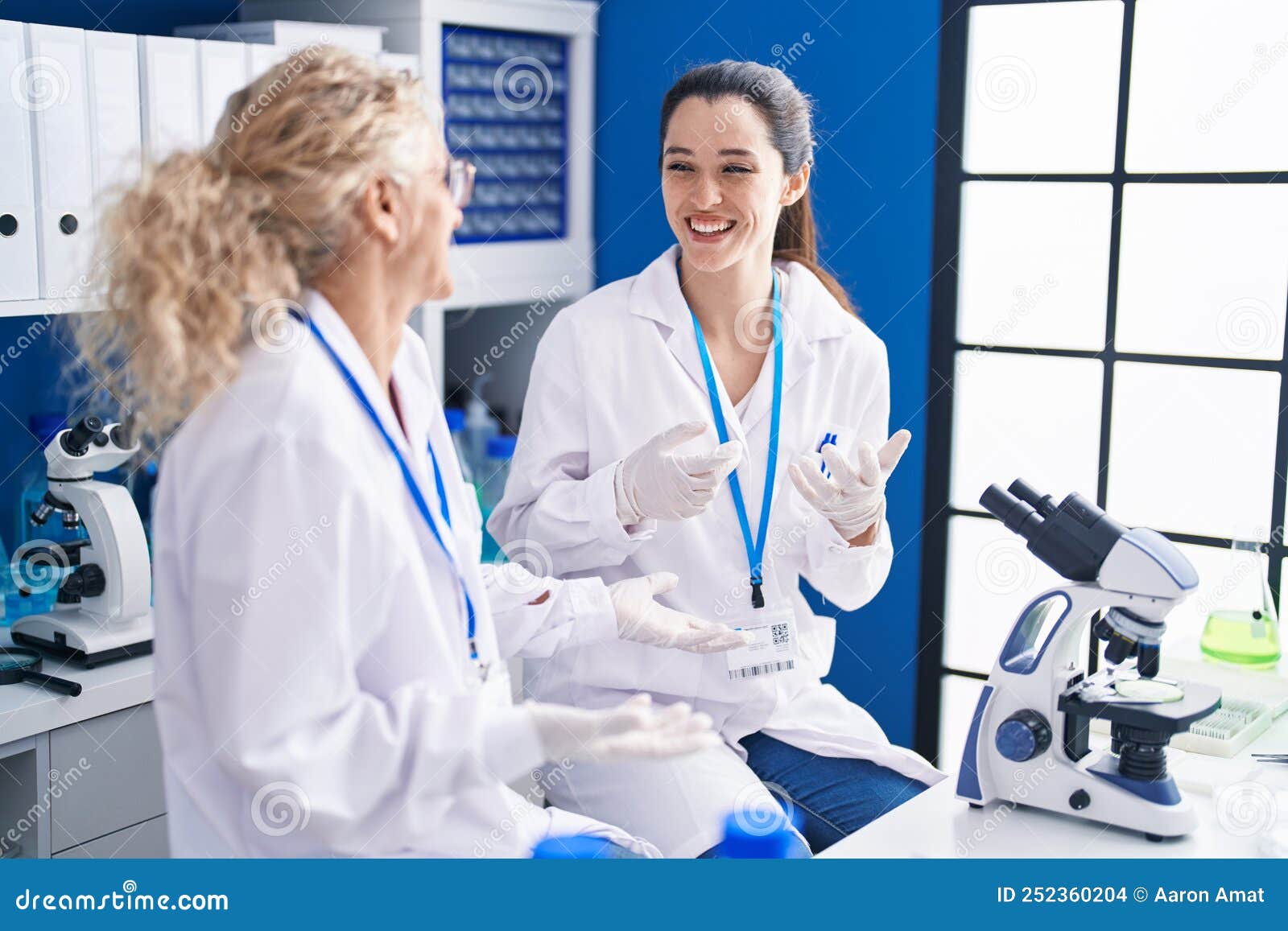 Two Women Scientists Smiling Confident Speaking at Laboratory Stock ...