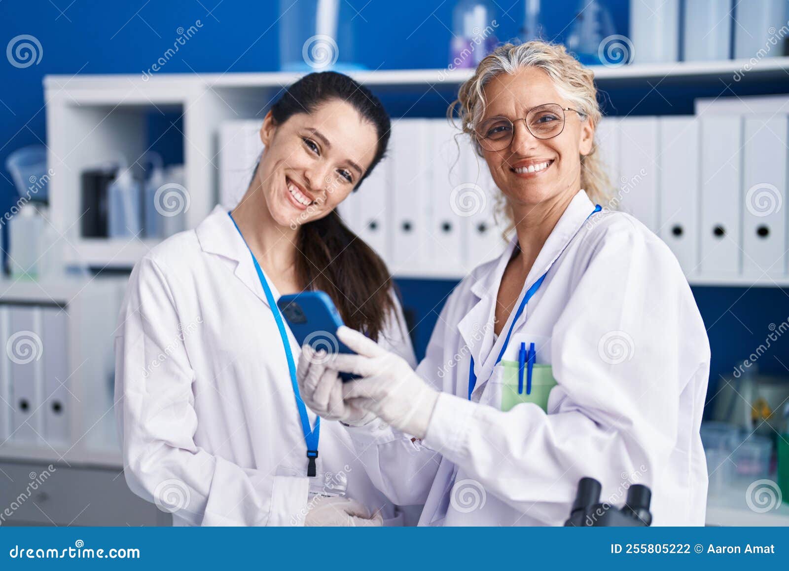 Two Women Scientists Using Smartphone Working at Laboratory Stock Photo ...