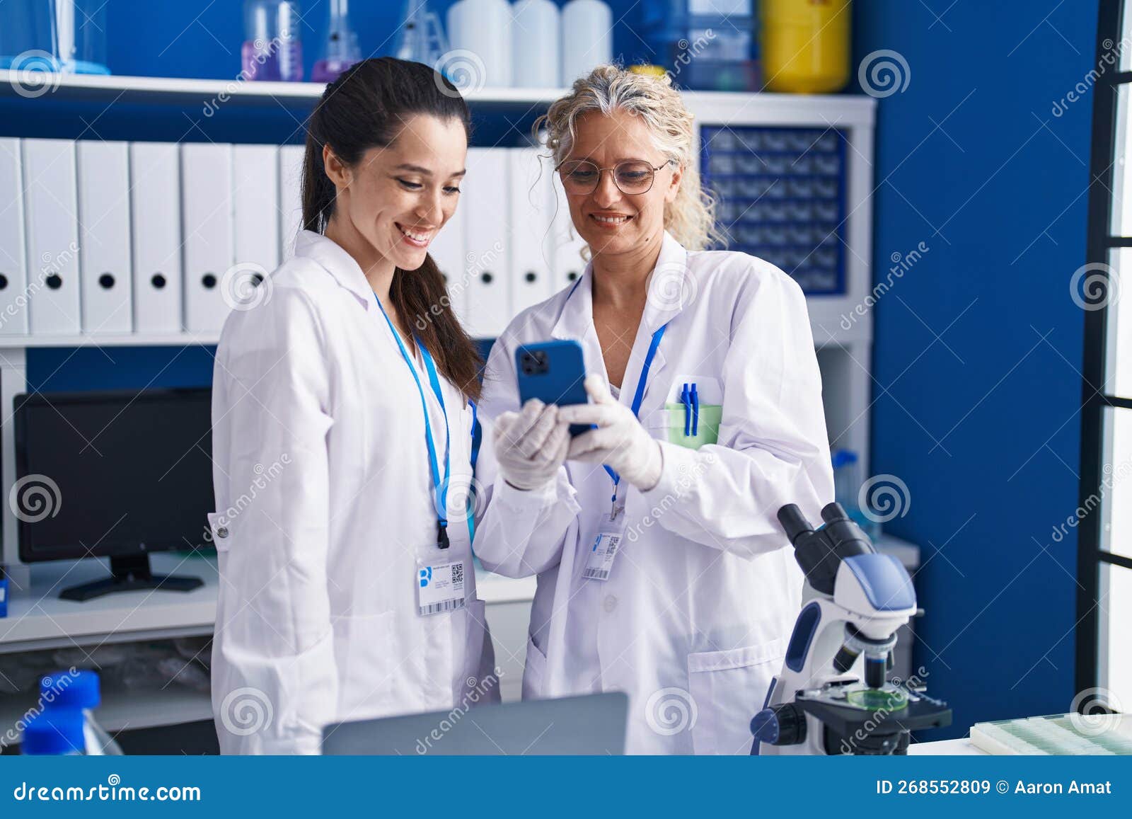 Two Women Scientists Using Smartphone Working at Laboratory Stock Image ...