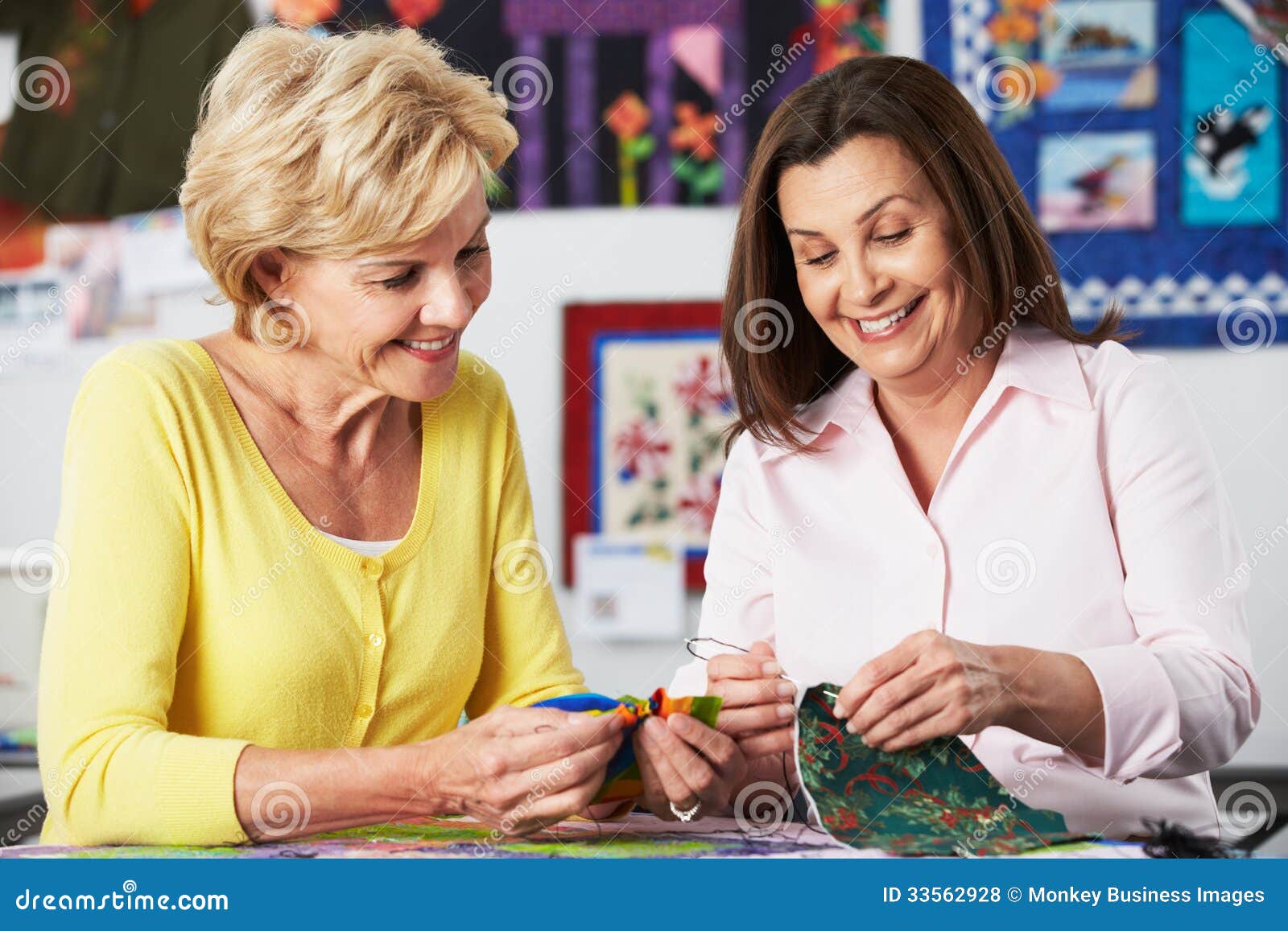 Two Women Sewing Quilt Together Stock Photo - Image of quilt, stitching ...