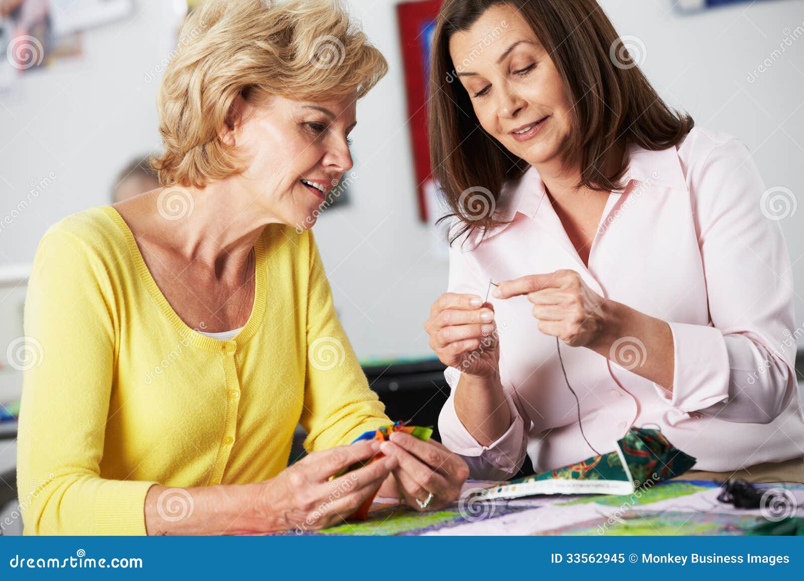 Two Women Sewing Quilt Together Stock Image - Image of caucasian ...