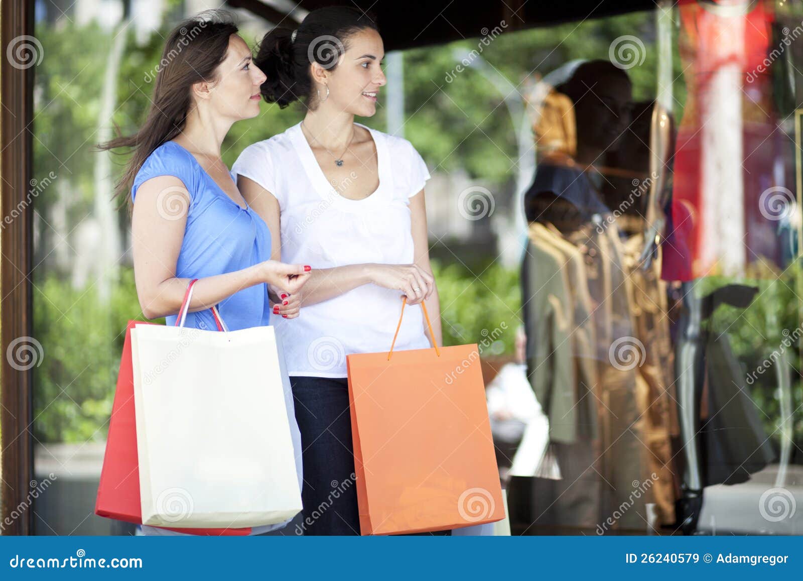 Two women shopping stock image. Image of looking, spend - 26240579