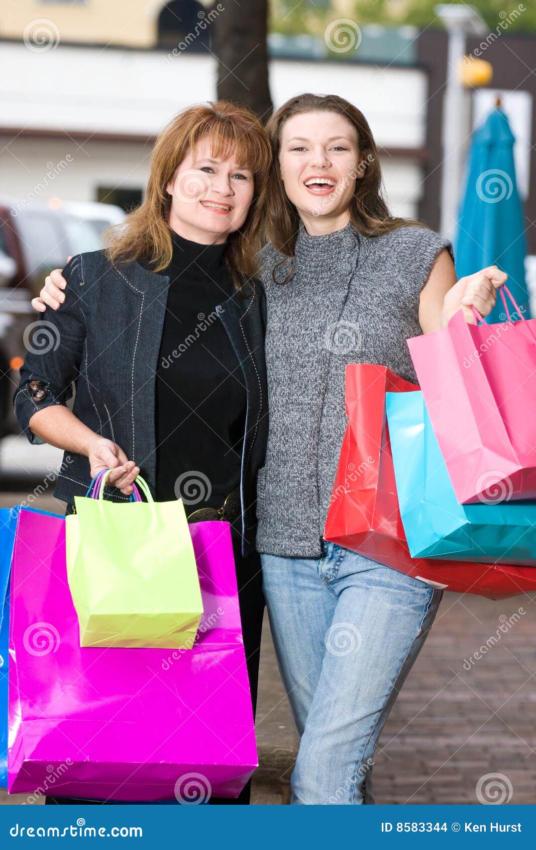 Two Women Shopping stock photo. Image of cheerful, carrying - 8583344