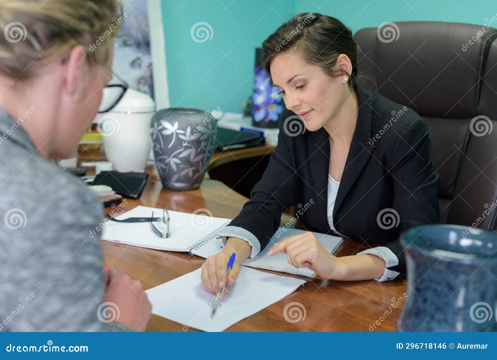 Two women signing document stock photo. Image of manager - 296718146