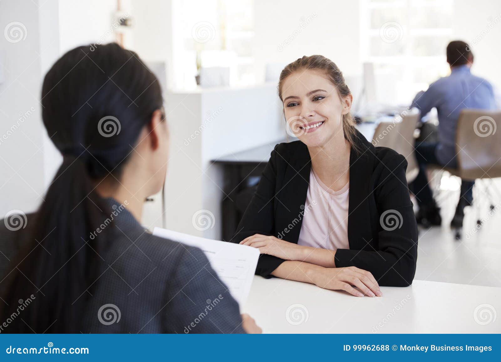 Two Women Sitting at an Interview in an Open Plan Office Stock Photo ...