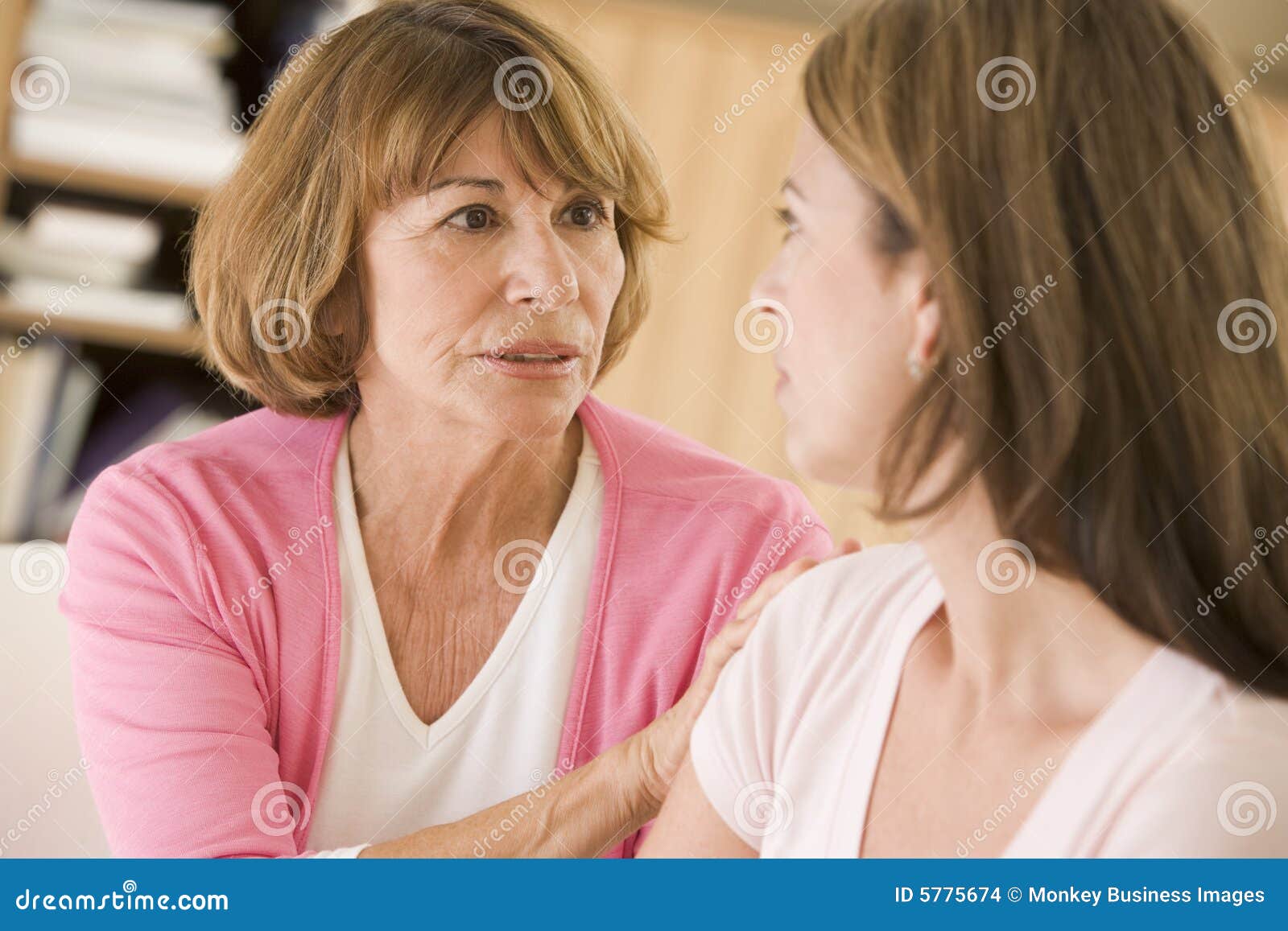 Two Women Sitting in Living Room Talking Stock Photo - Image of indoors ...