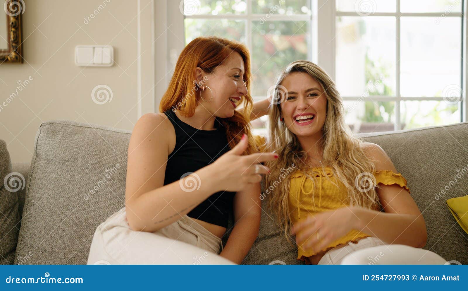 Two Women Sitting on Sofa Speaking at Home Stock Image - Image of rest ...
