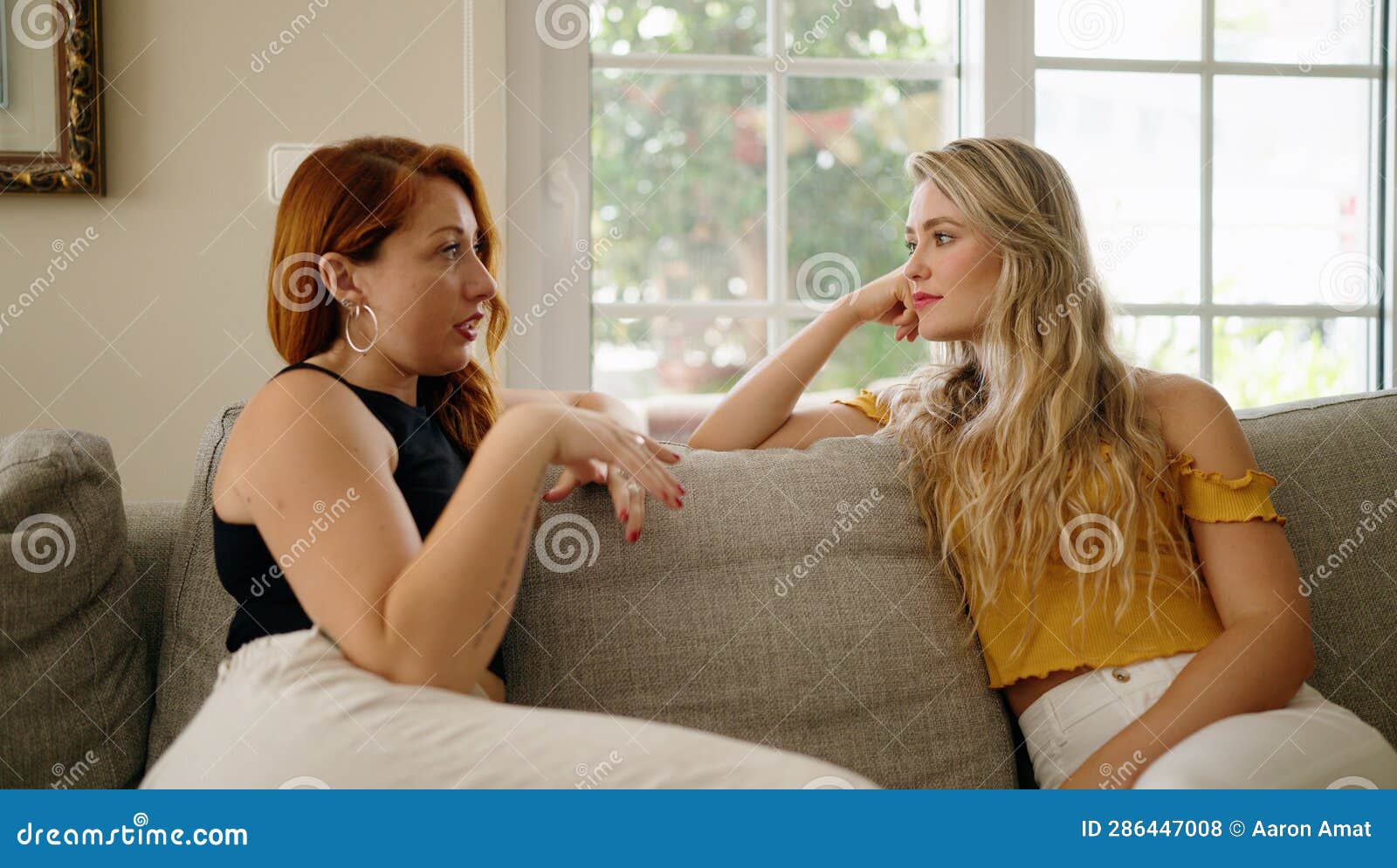 Two Women Sitting on Sofa Speaking at Home Stock Photo - Image of enjoy ...