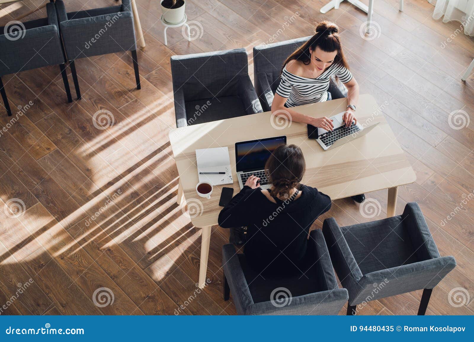 Two Women are Sitting at the Table and Discussing Job Problems and ...
