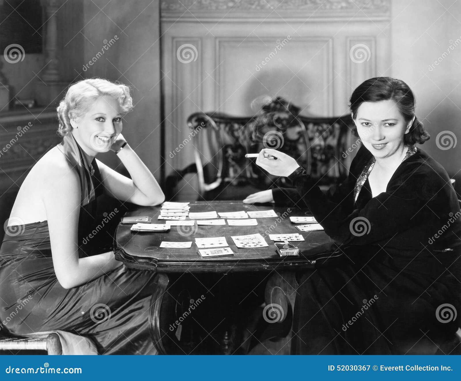 Two Women Sitting Together Playing Cards Stock Image - Image of betting ...