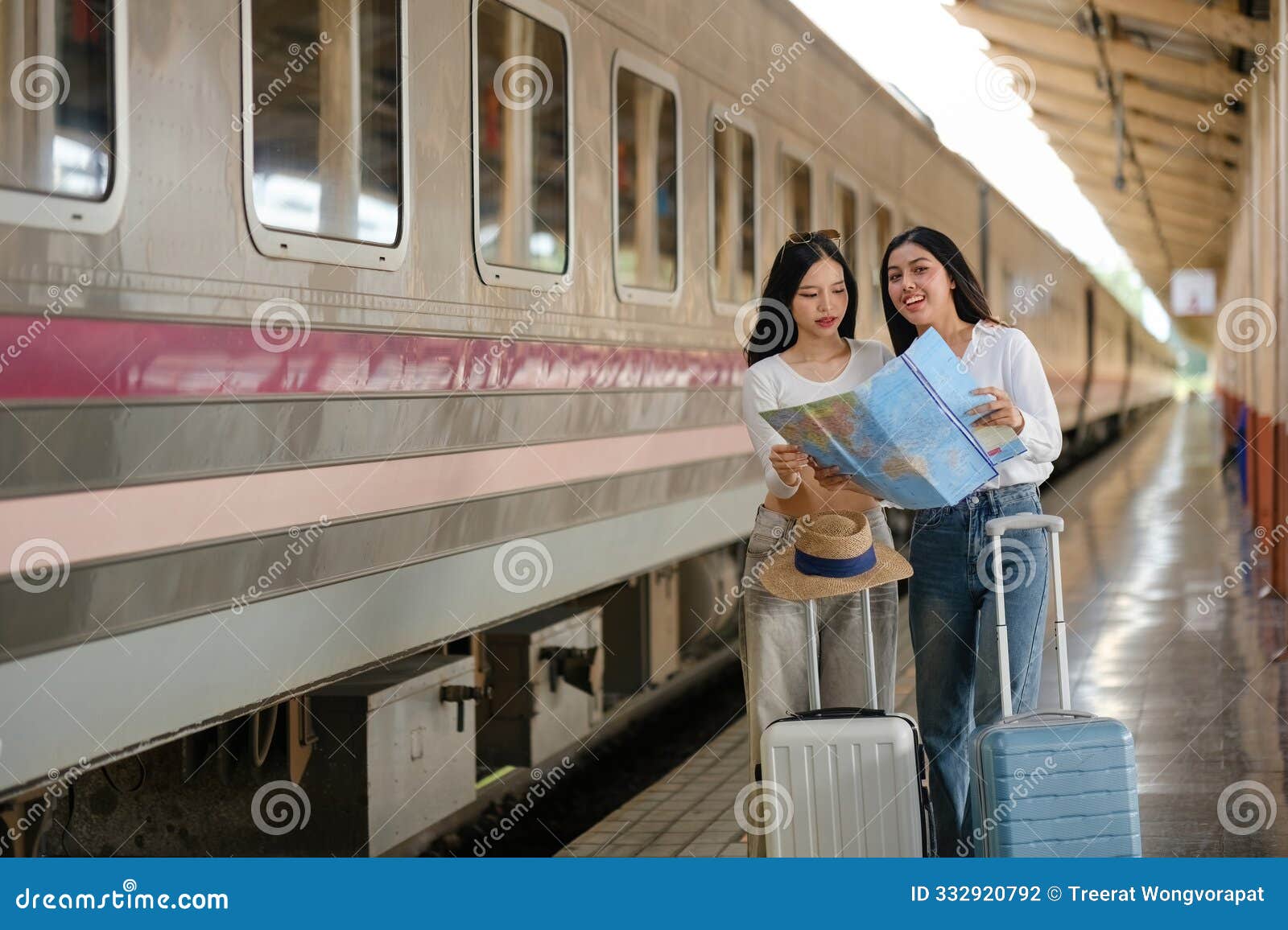 Two Women are Standing on a Train Platform, Looking at a Map Stock ...