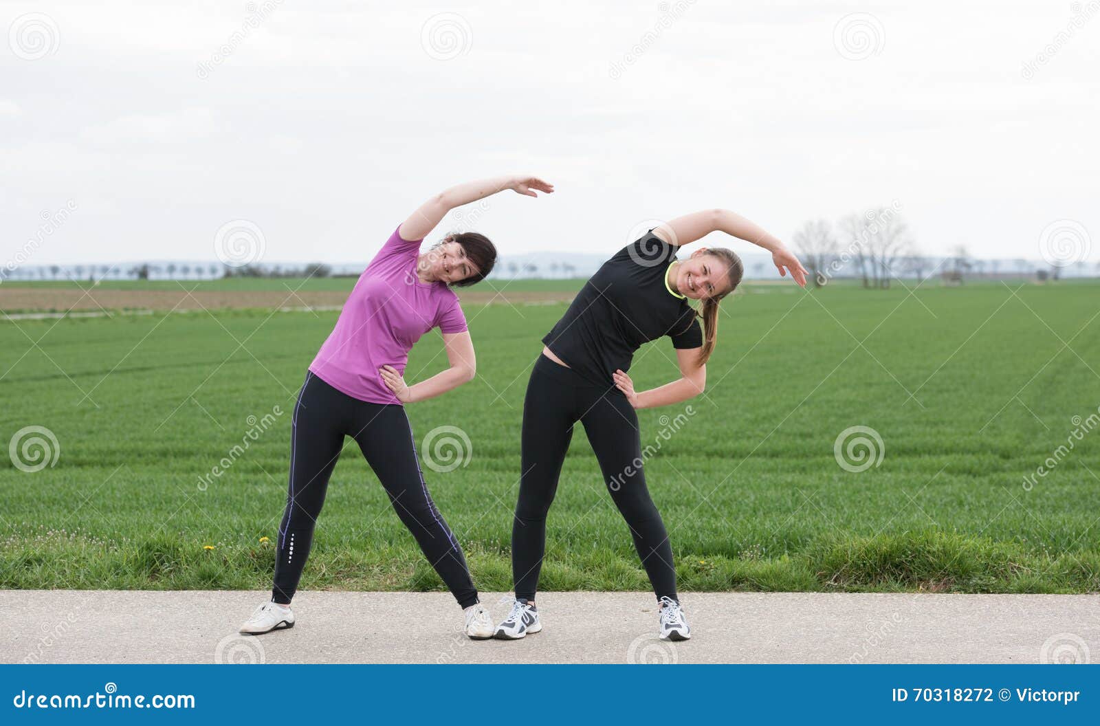 Two Women Stetching Outdoors Stock Photo - Image of girl, leisure: 70318272