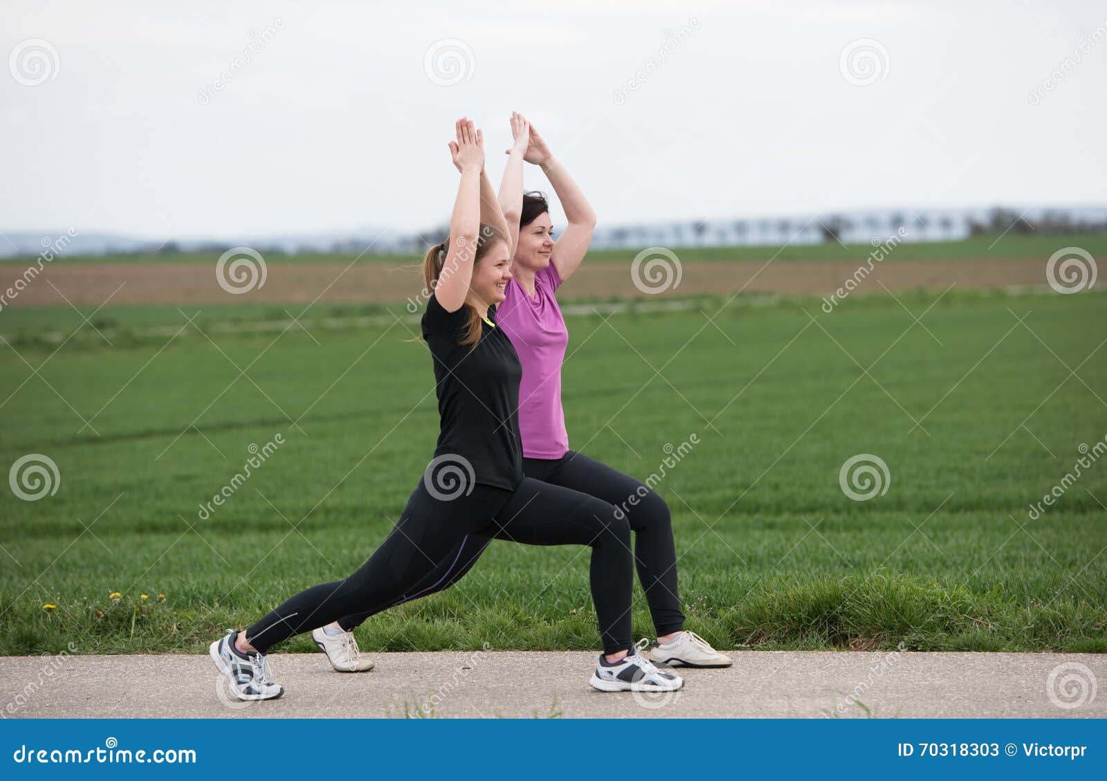 Two Women Stetching Outdoors Stock Image - Image of outside, nature ...