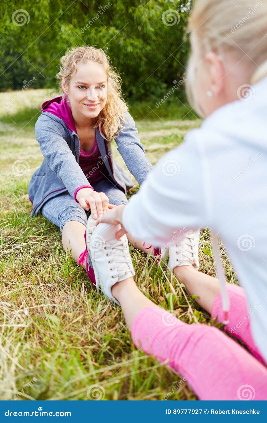 Two Women Stretching Together Stock Image - Image of healthy, vital ...