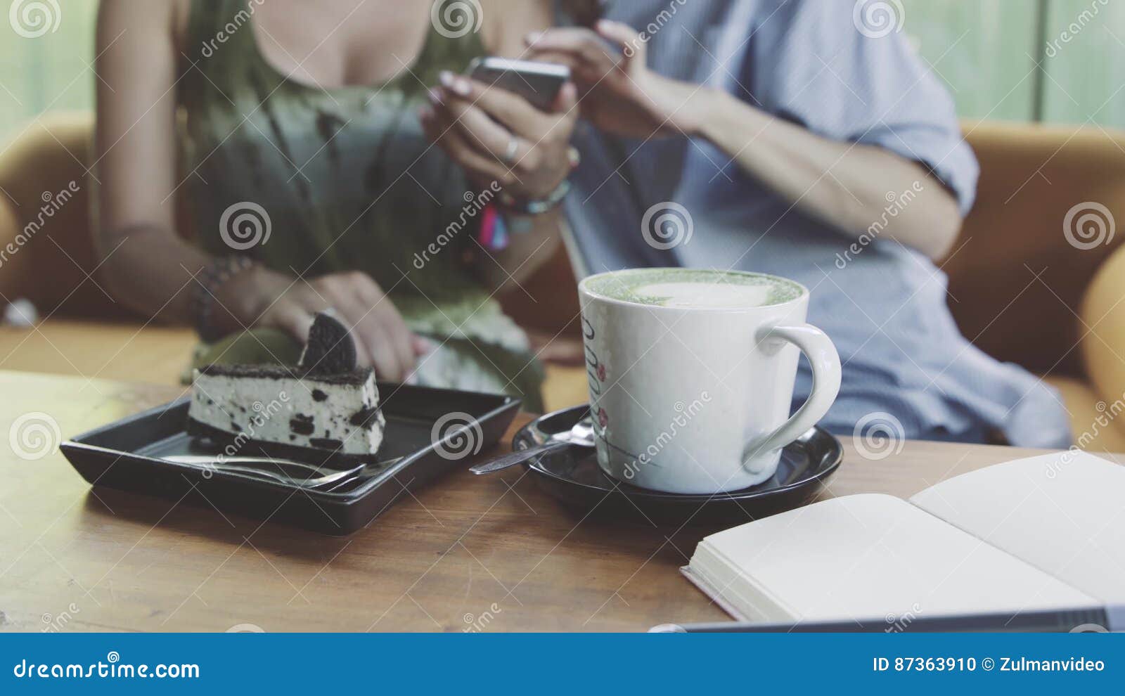 Two Women Using Digital Tablet Drinking Coffee in Cafe Stock Photo ...