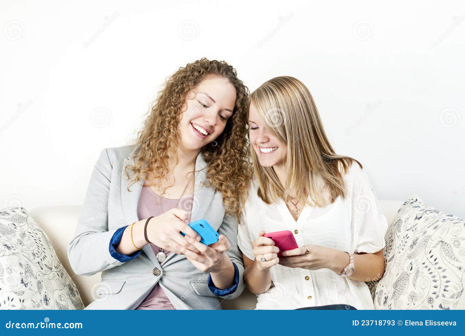 Two Women Using Mobile Devices Stock Image - Image of cases, show: 23718793