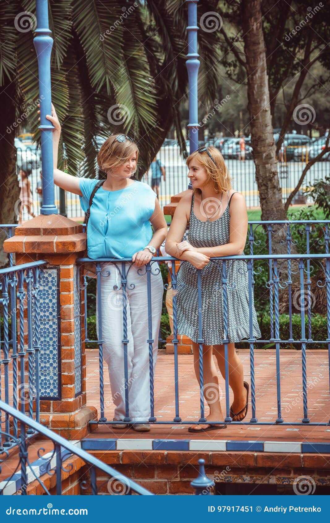 Two women on walk in park stock image. Image of dress - 97917451