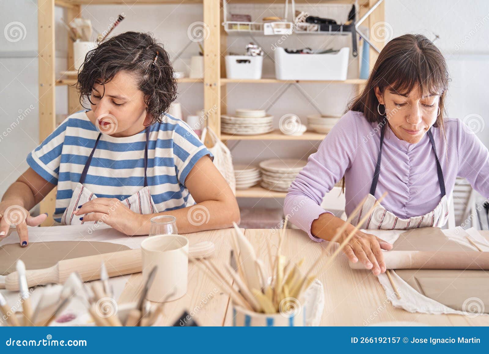 Two Women Working with Clay in a Pottery Workshop. Stock Image - Image ...
