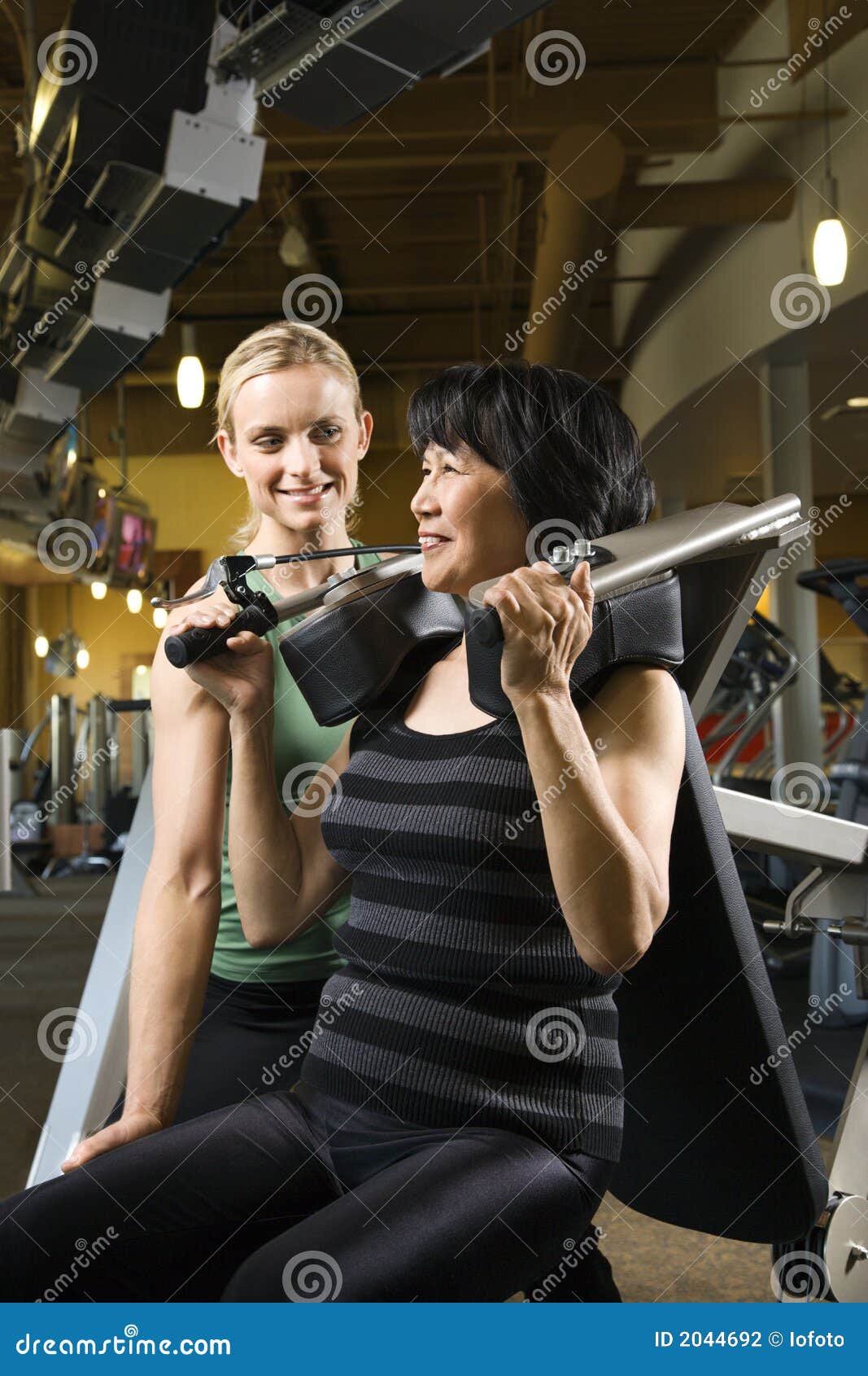 Two women working out. stock photo. Image of adult, help - 2044692