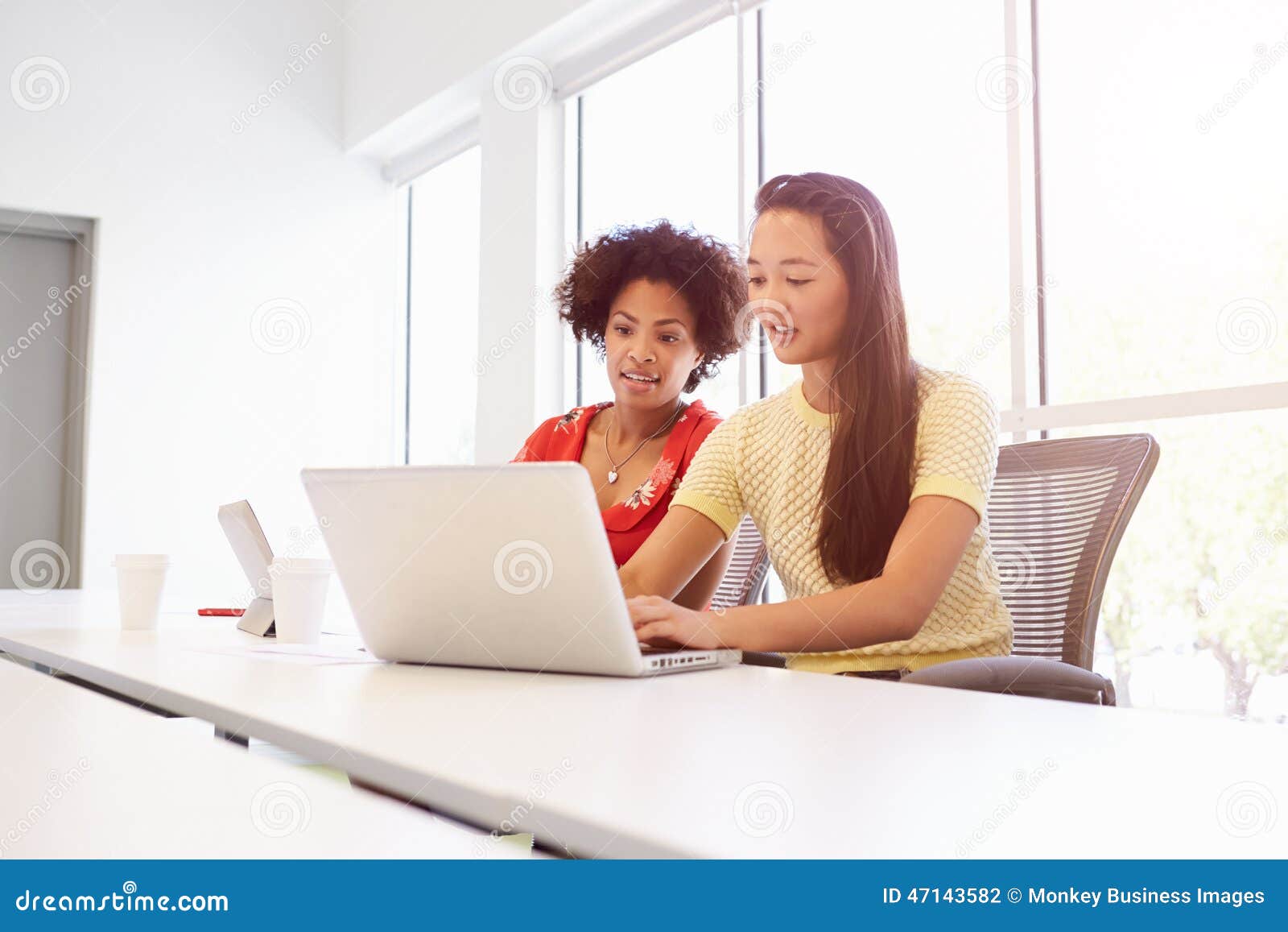 Two Women Working Together in Design Studio Stock Photo - Image of ...
