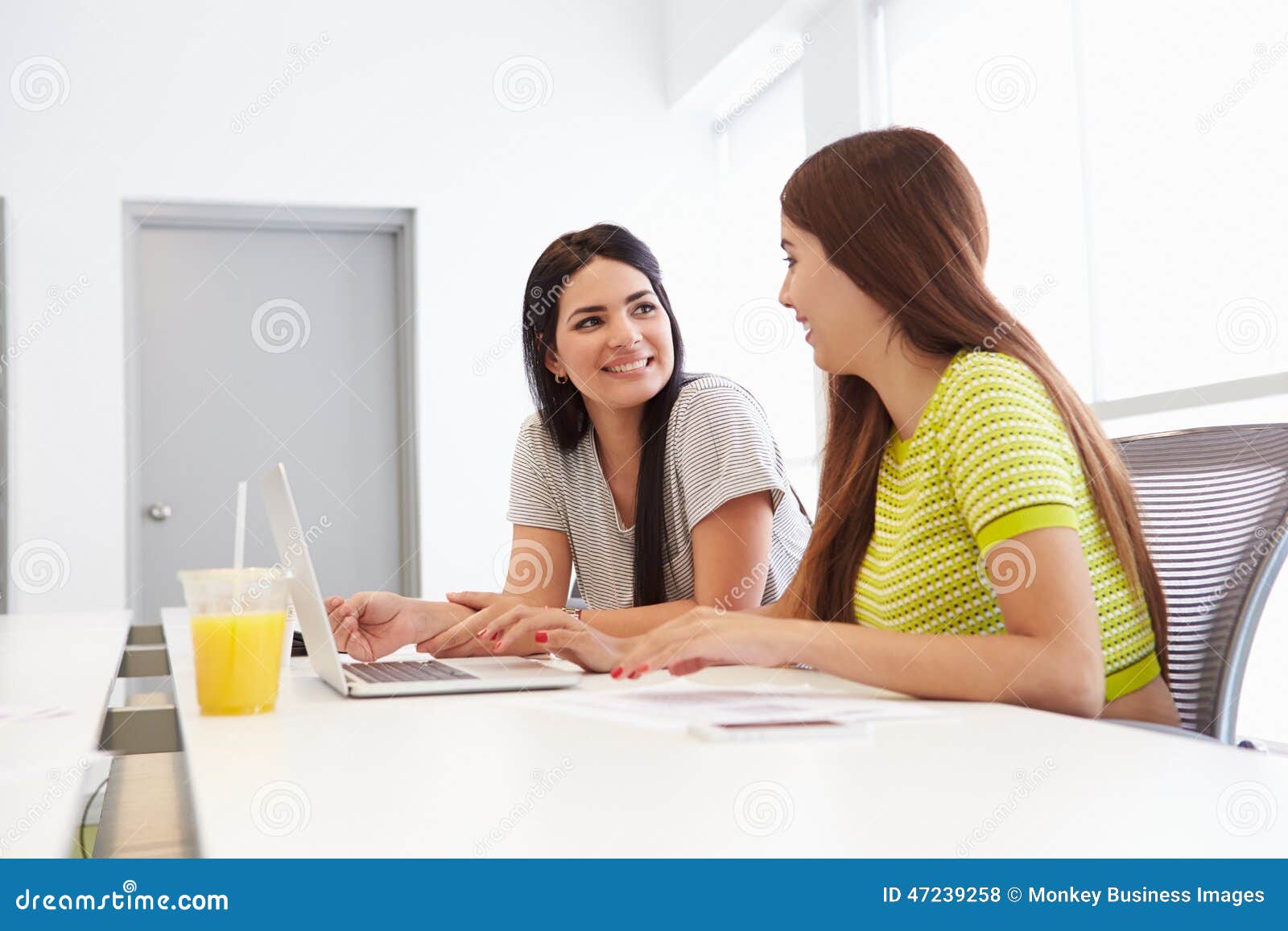 Two Women Working Together in Design Studio Stock Photo - Image of ...