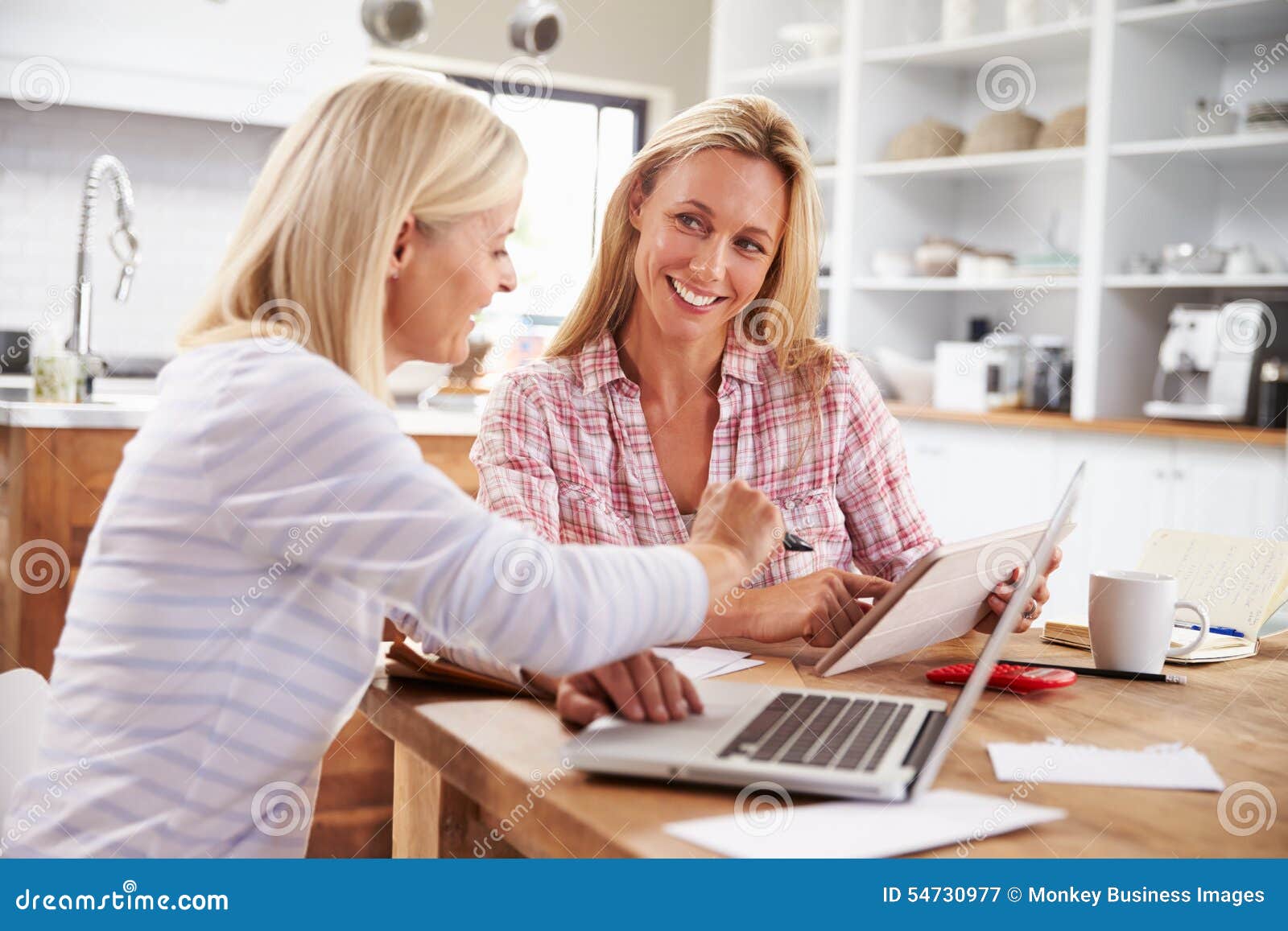 Two Women Working Together at Home Stock Image - Image of digital ...
