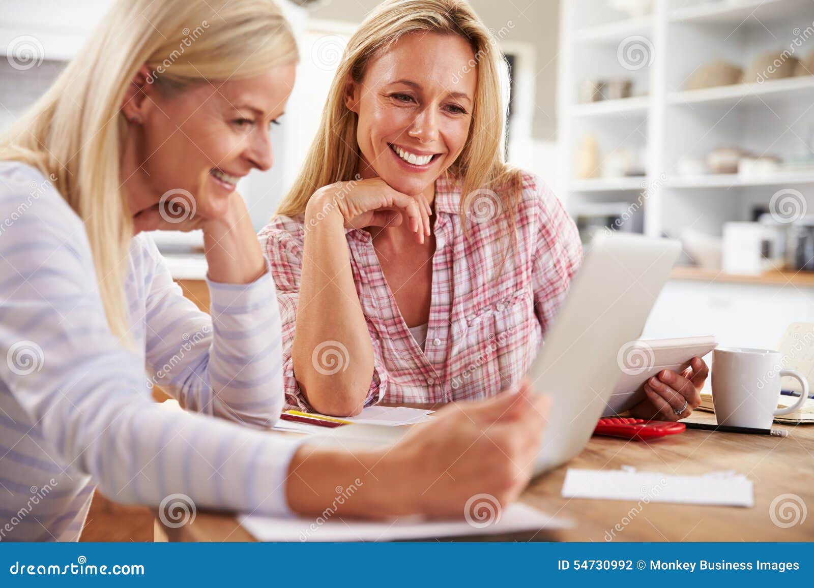 Two Women Working Together at Home Stock Photo - Image of focus ...