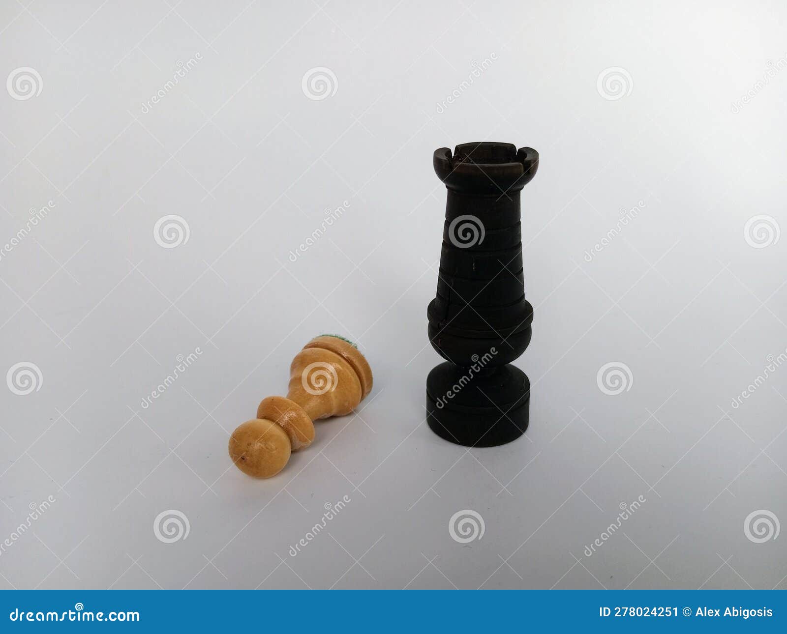 Two Wood Chess Pieces One Laying on Its Side on a White Background ...