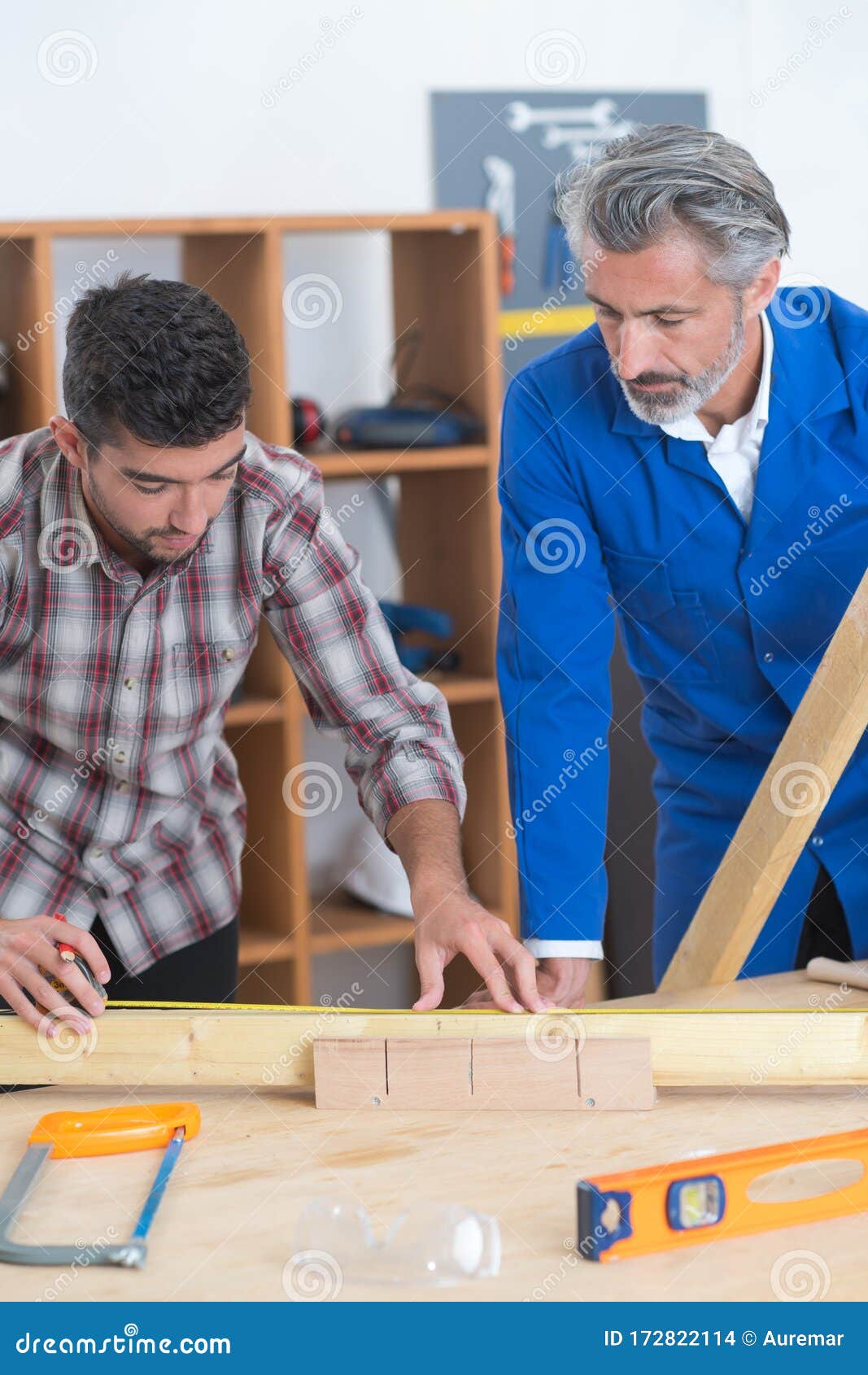 Two Wood Workers in Carpentry Measuring Boards Stock Photo - Image of ...