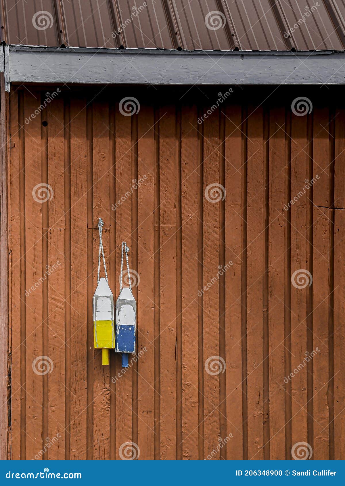 Two Wooden Buoys on a Brown Wall Stock Photo - Image of lobster, lumber ...