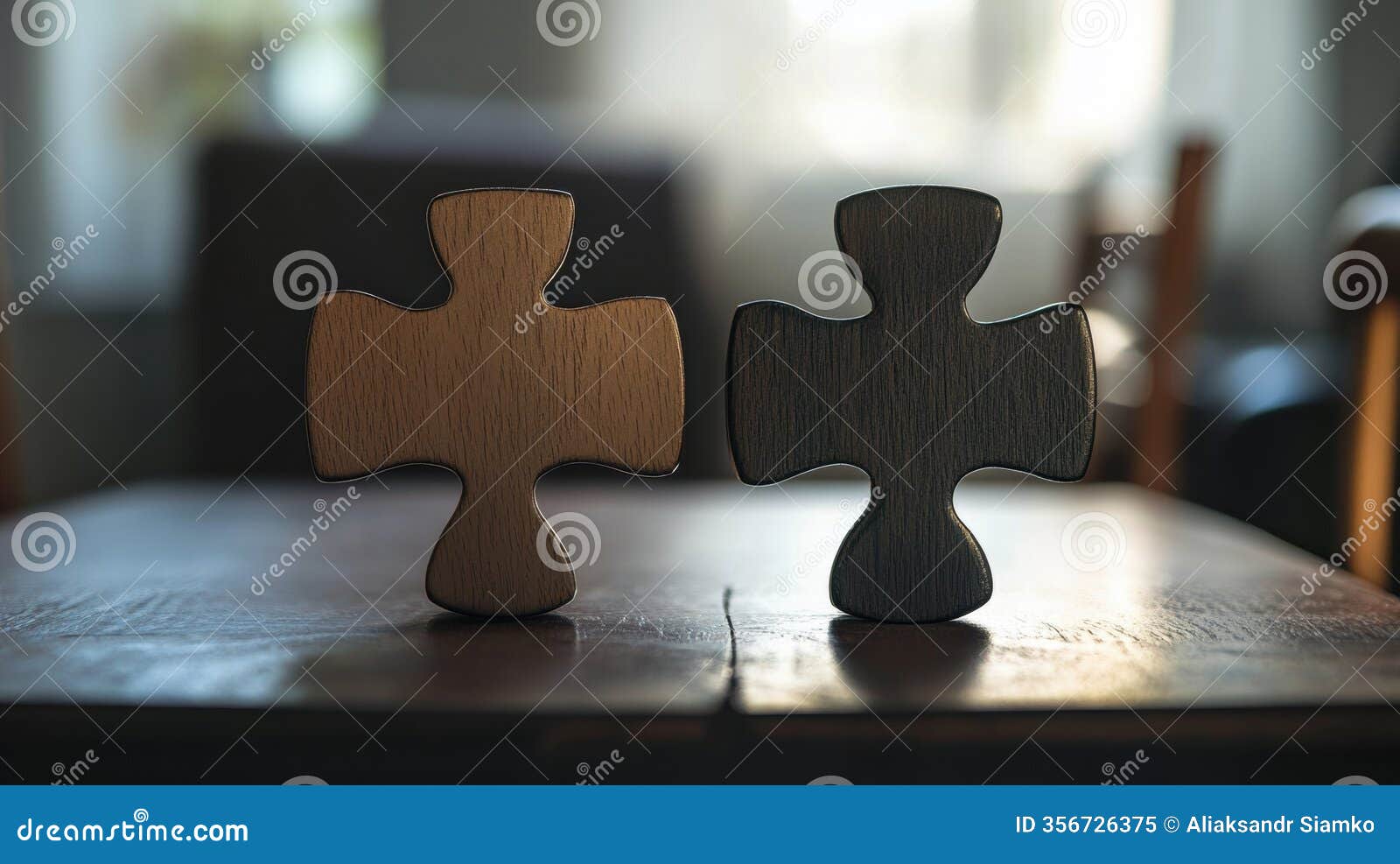 Two Wooden Puzzle Pieces Facing Each Other on a Table Stock ...