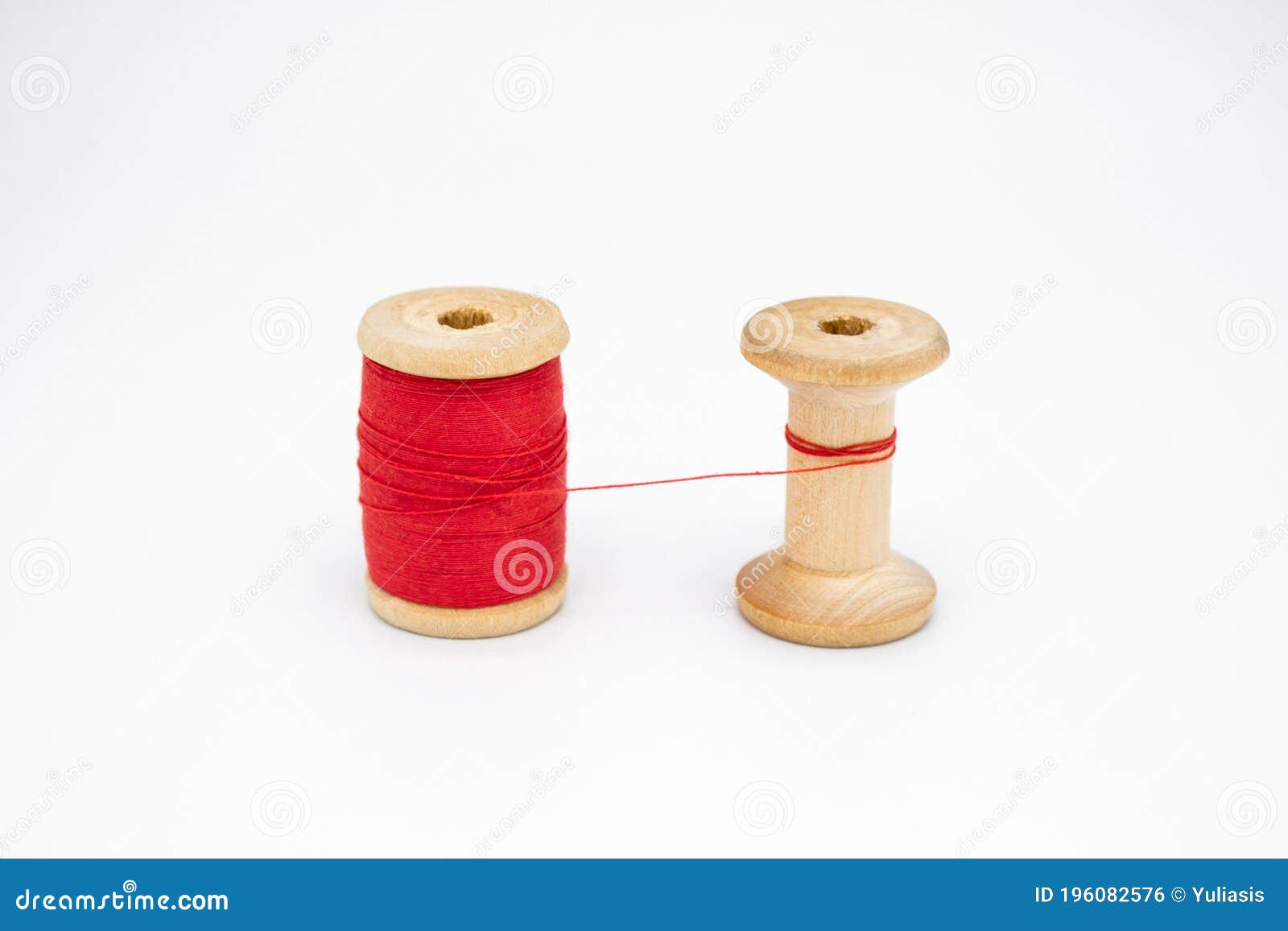 Two Wooden Spools of Thread. One is Full, the Other almost Empty ...