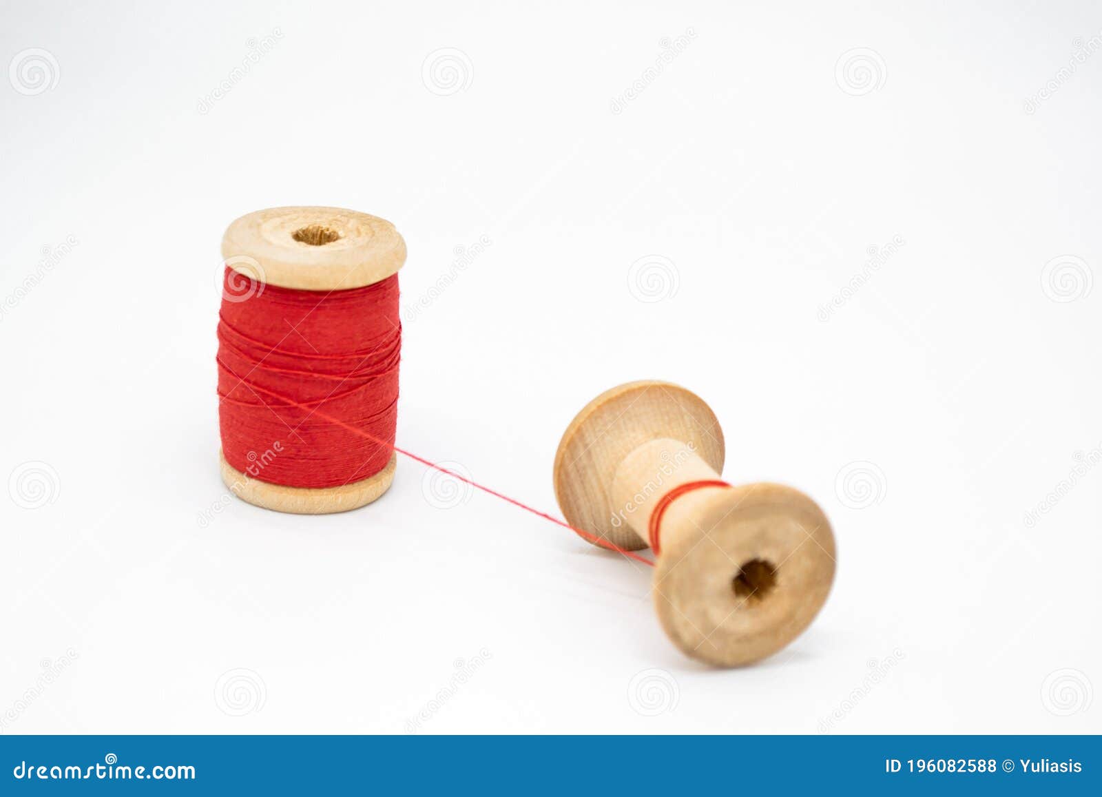 Two Wooden Spools of Thread. One is Full, the Other almost Empty ...