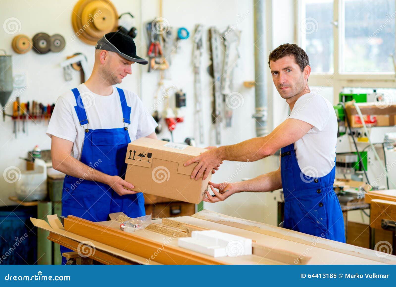 Two Worker with Cardboard in a Carpenter S Workshop Stock Photo - Image ...