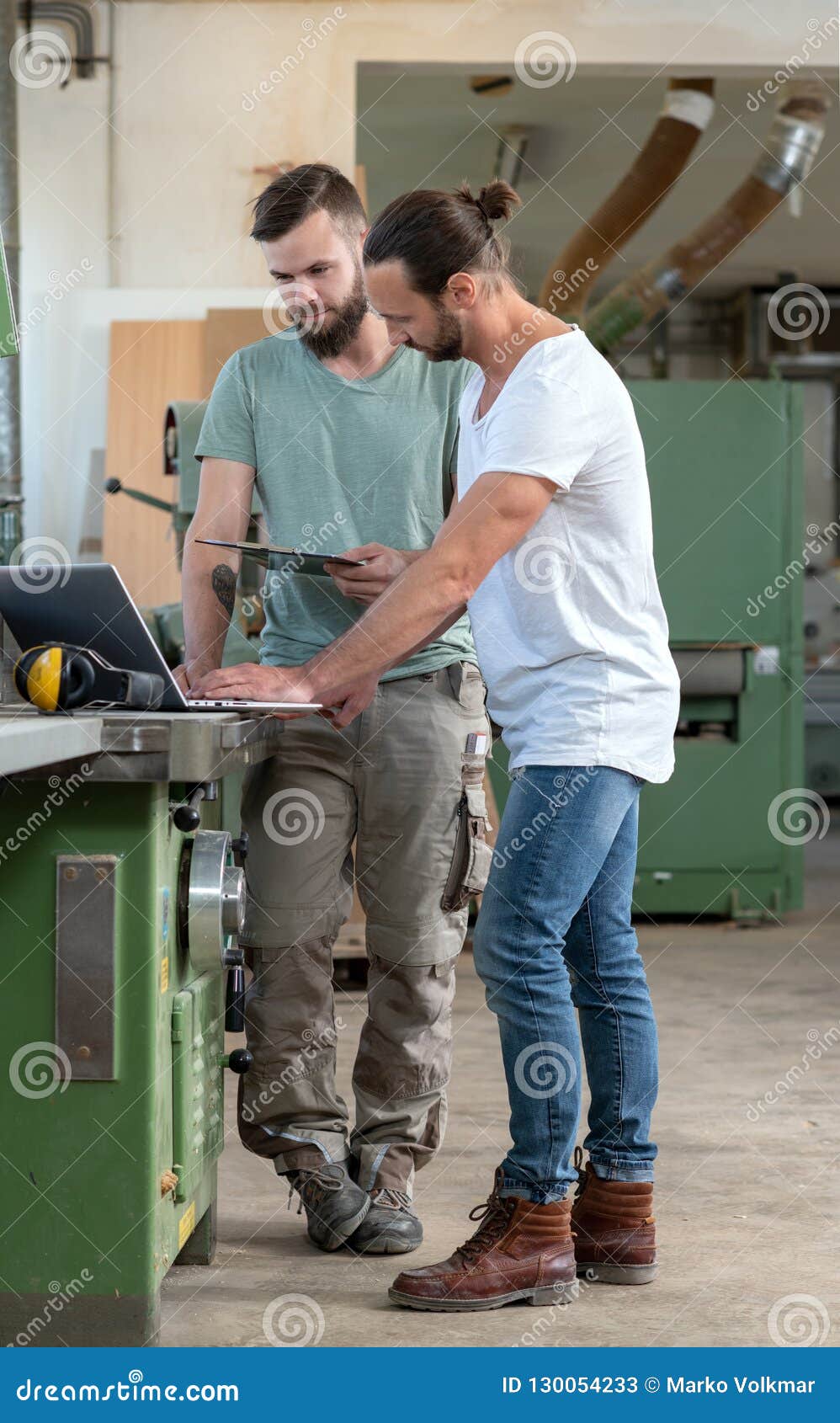Two Worker in a Carpenter`s Workshop with Computer and Clipboard Stock ...