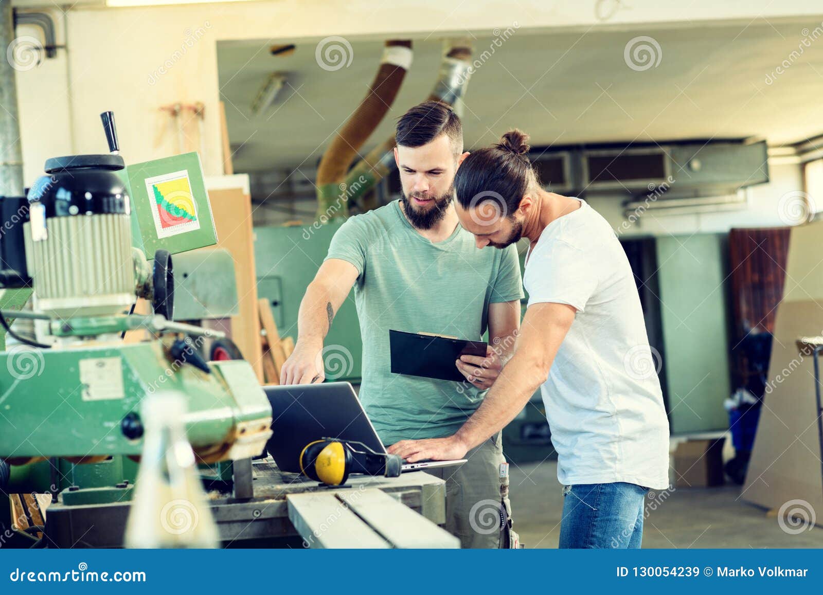 Two Worker in a Carpenter`s Workshop with Computer and Clipboard Stock ...