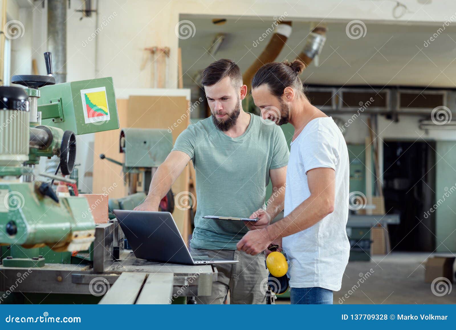 Two Worker in a Carpenter`s Workshop with Computer and Clipboard Stock ...