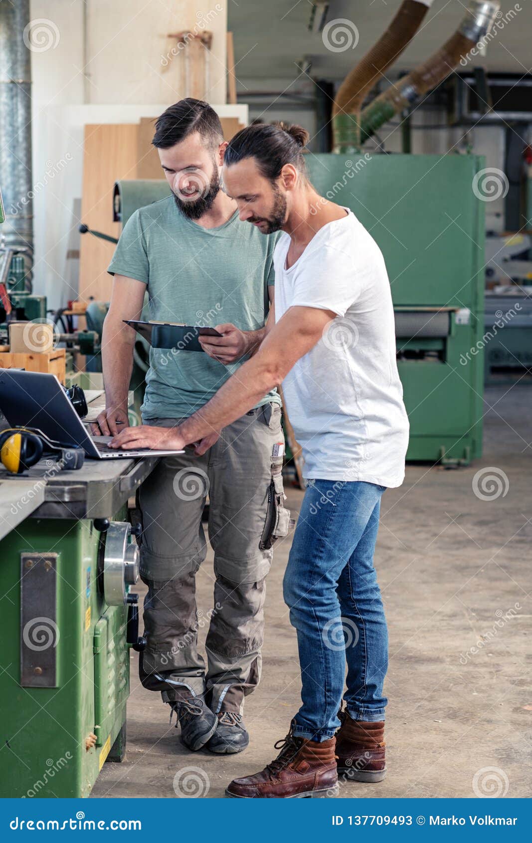Two Worker in a Carpenter`s Workshop with Computer and Clipboard Stock ...