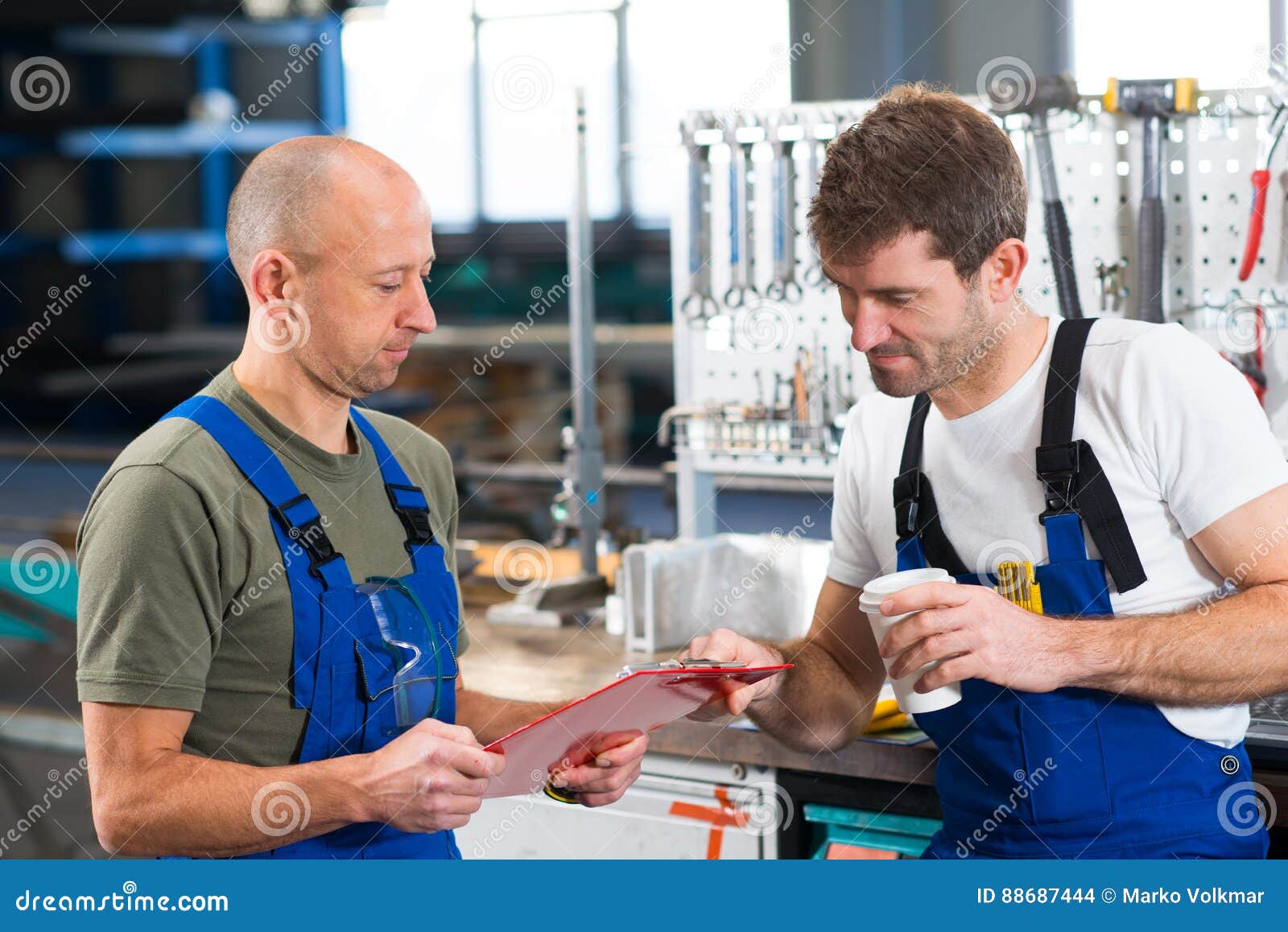 Two Worker in Factory in Conversation Stock Photo - Image of ...