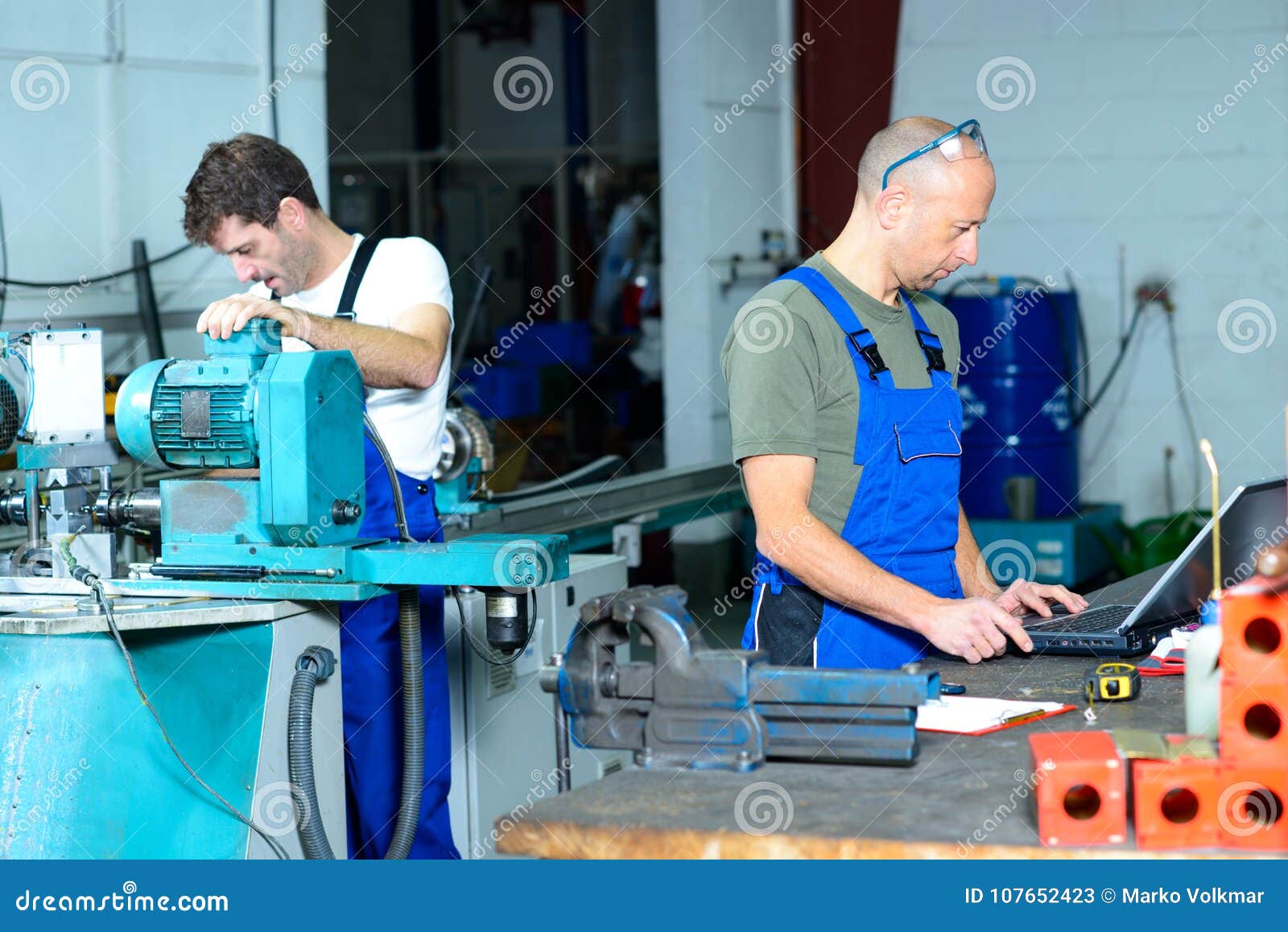 Two worker in factory stock image. Image of improvement - 107652423