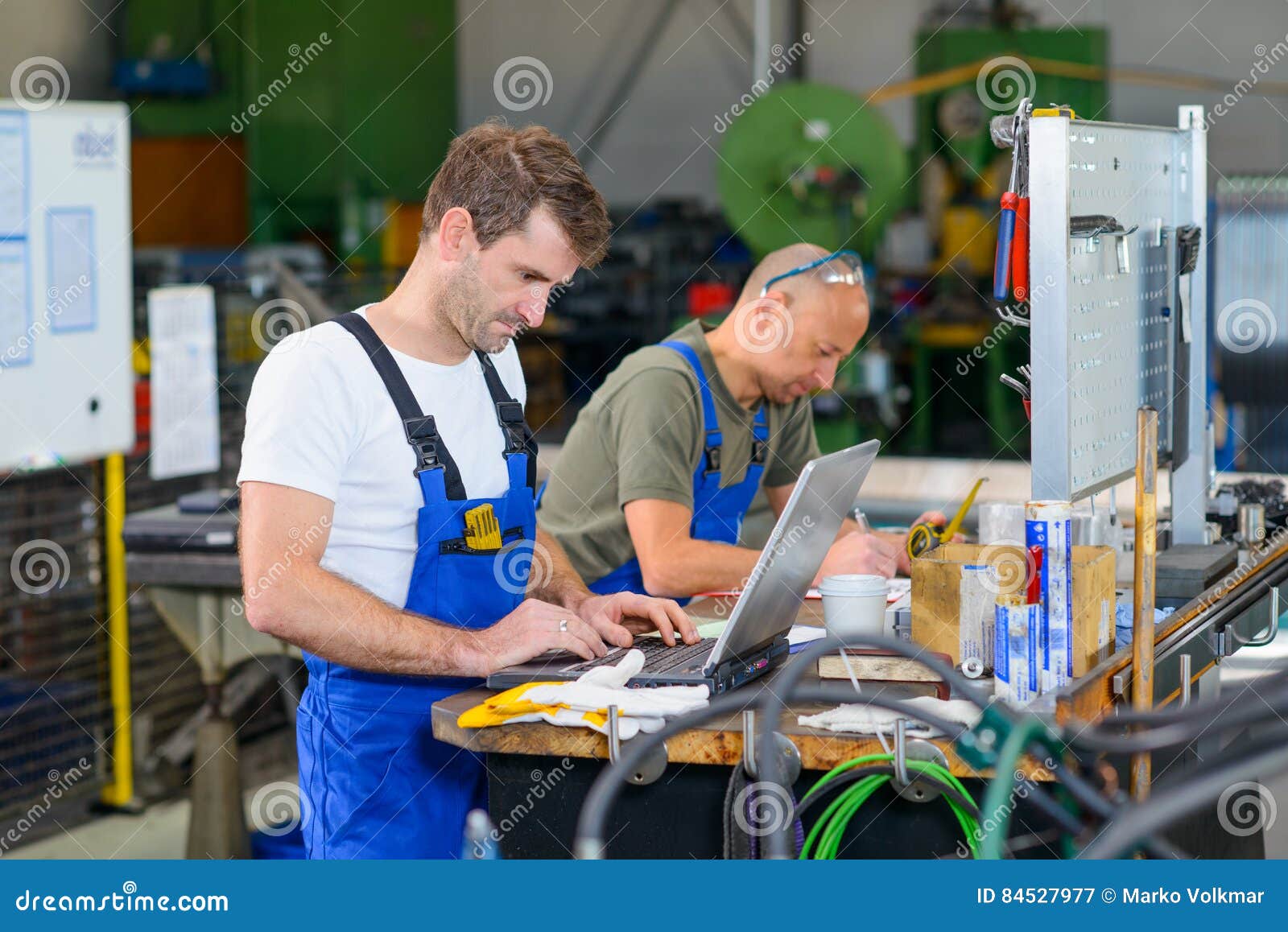 Two worker in factory stock image. Image of male, improvement - 84527977