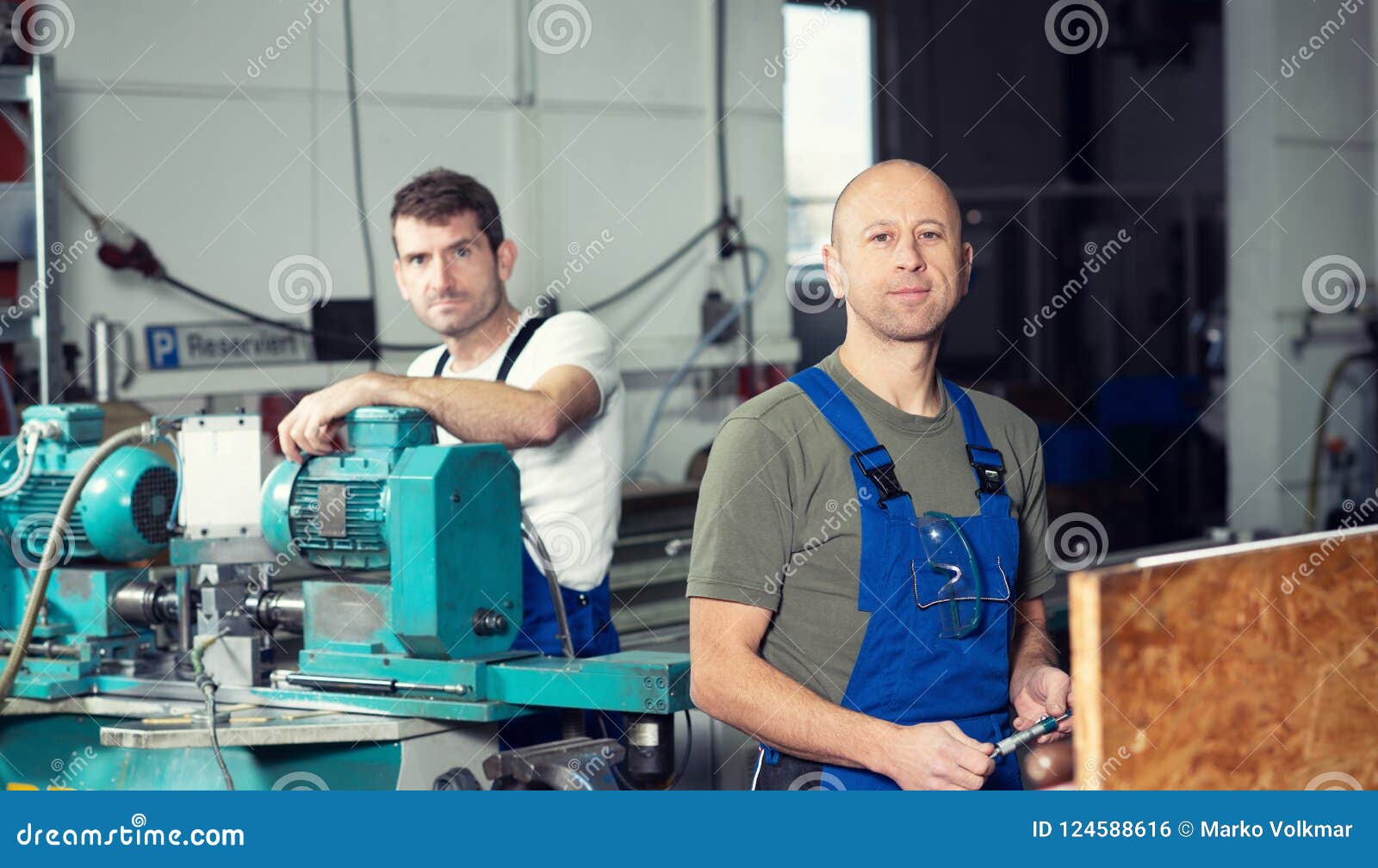Two worker in factory stock photo. Image of plant, equipment - 124588616